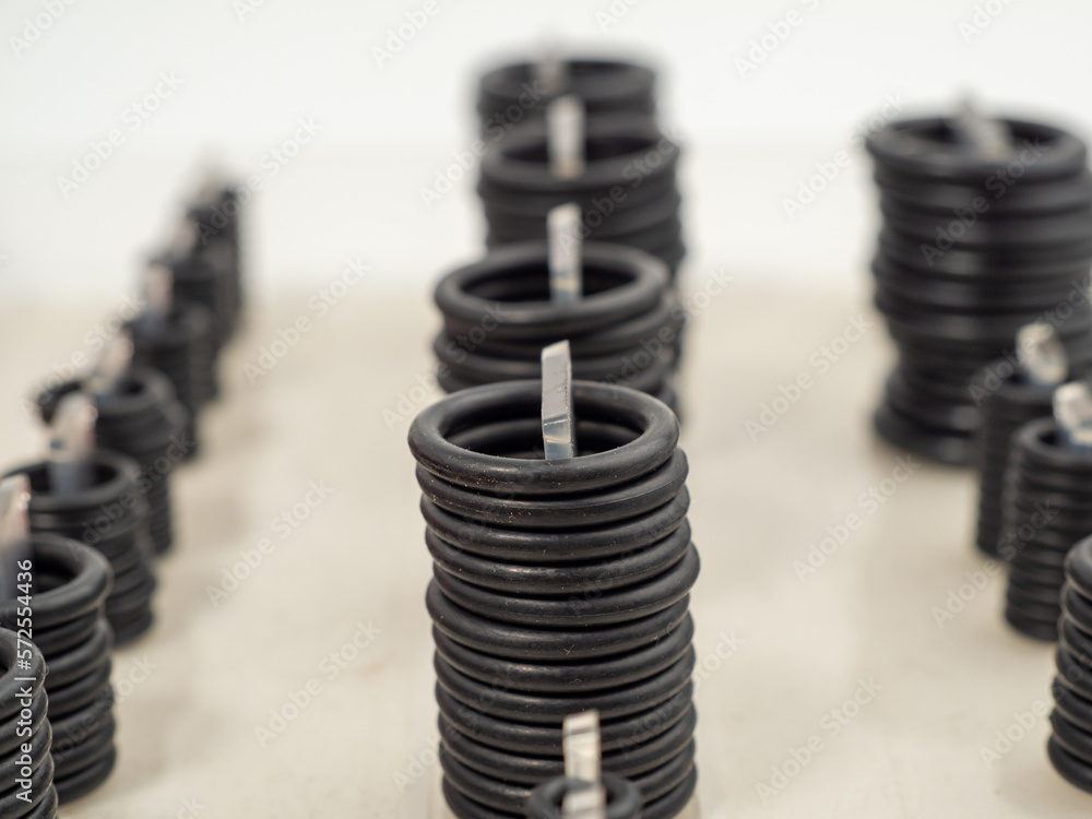 Hydraulic and pneumatic o-rings in black in different sizes on a white ...
