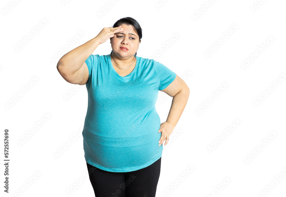 Depressed overweight indian woman having headache standing against ...