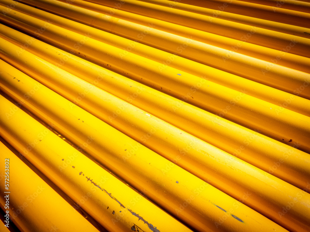 tubos de color amarillo intenso agrupados Stock Photo | Adobe Stock