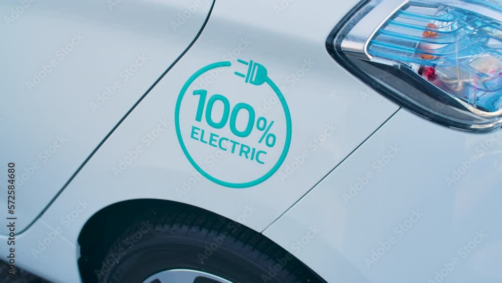 White Electric Car With 100% Electric Sticker On Exterior Side Surface ...
