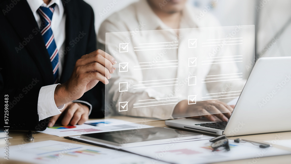 Businessman concept evaluating smart checklist on virtual screen ...