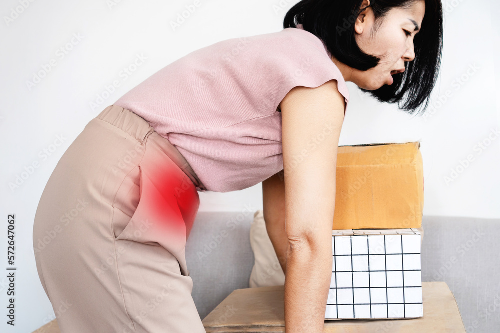 Asian woman suffering from abdominal pain or stomach muscle pain after ...