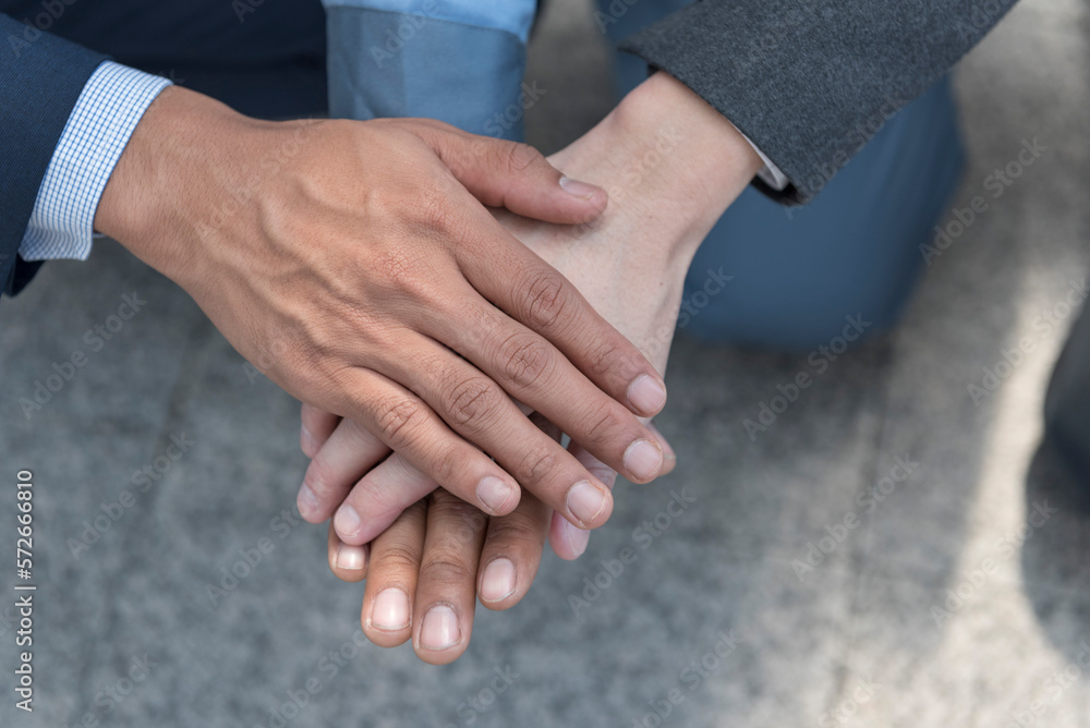 business people putting join hands together. Unity and teamwork show by ...
