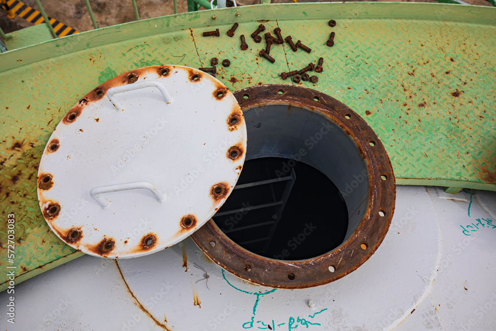 Poster Manhole open lid steel tank chemical methanol testing at front ...