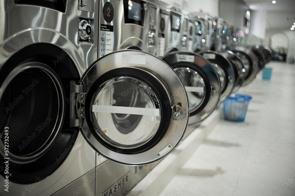 Closeup the front cover of washing machine with blurred row of vending ...