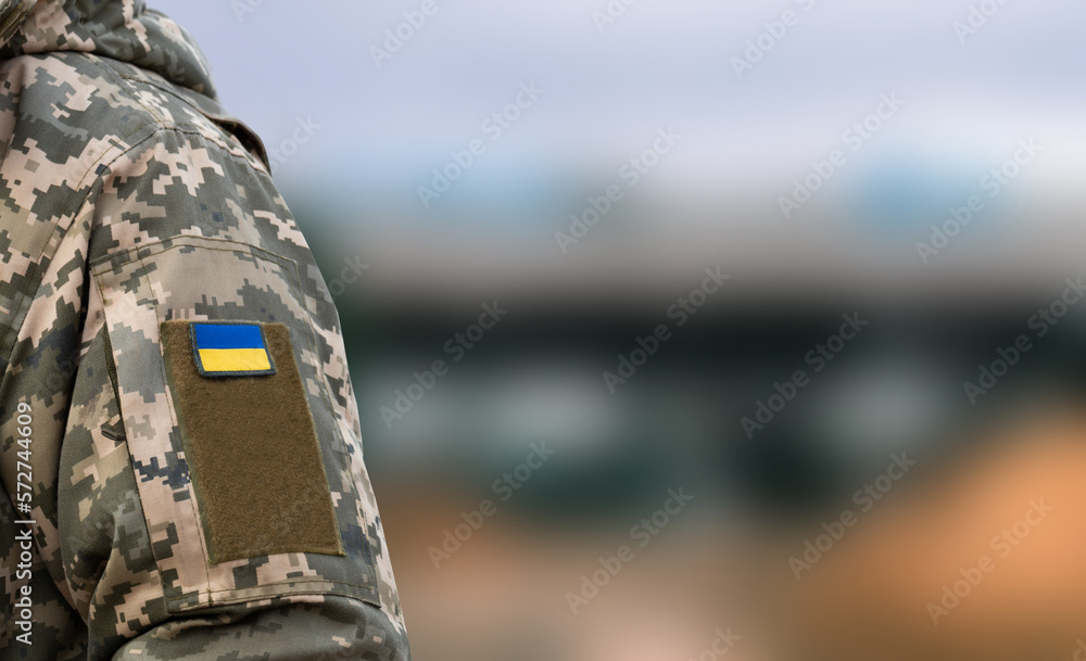 Ukrainian soldier in the army and flag, coat of arms with a golden ...