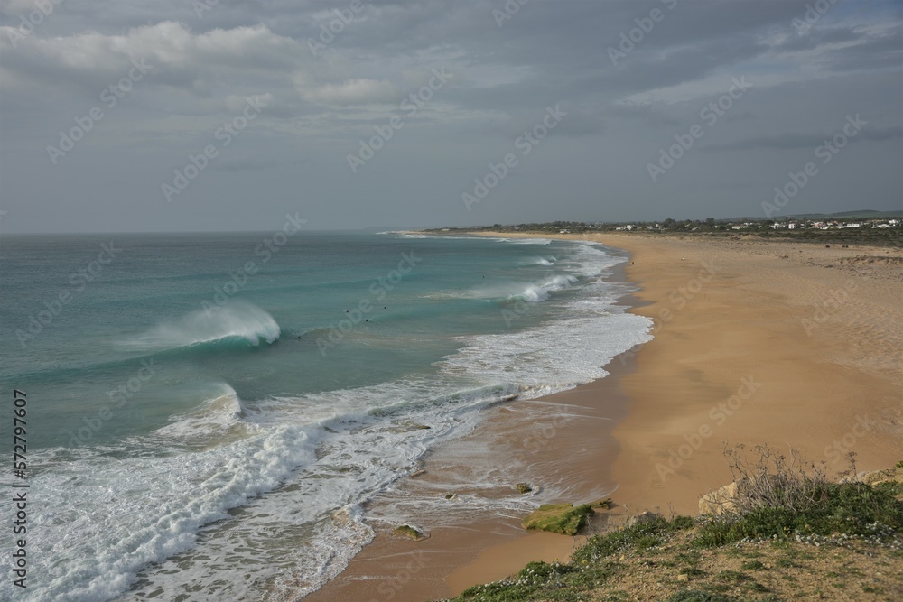 Big wave day at Zahora beach, scattered surfers in a swell blown open ...