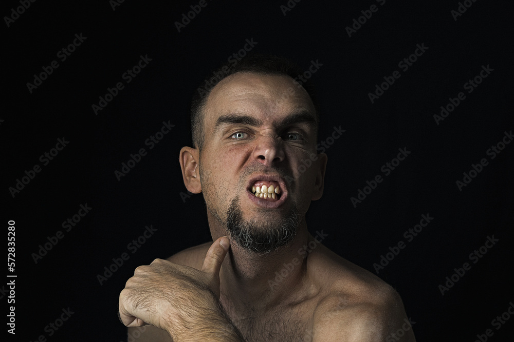 Caucasian man with an angry expression, threatening to kill. A man with ...