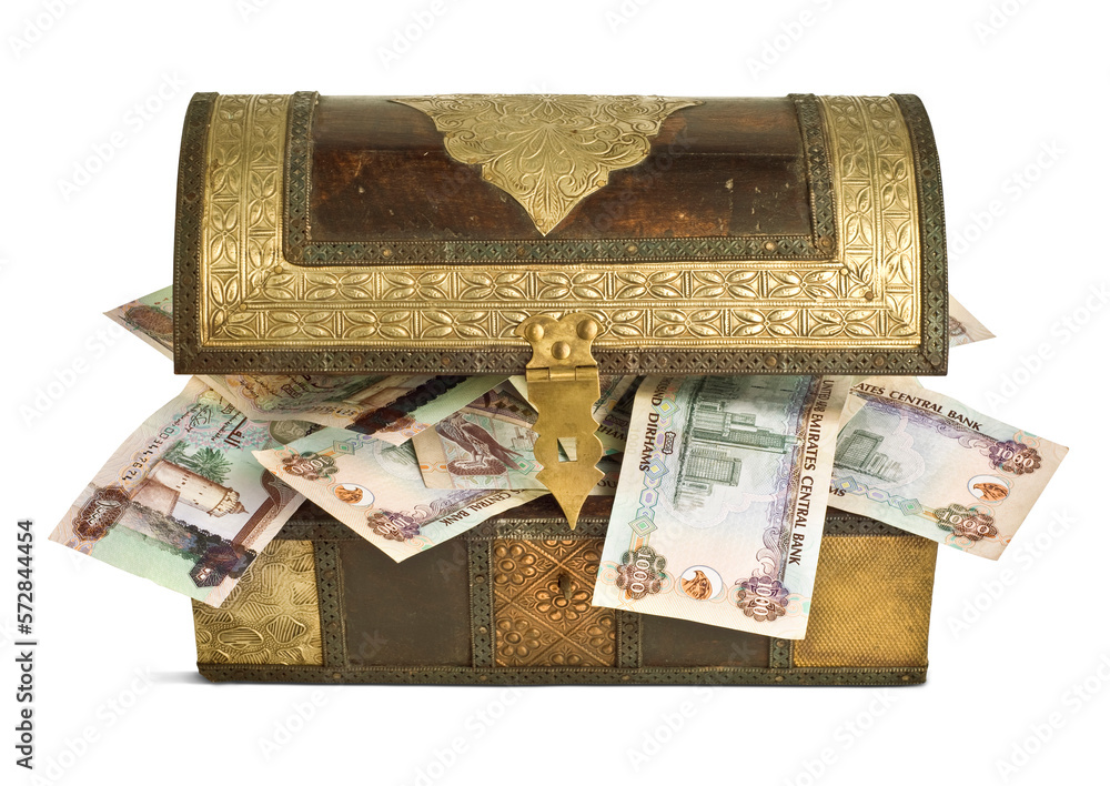 UAE dirham currency notes stuffed into the vintage wooden trunk or ...