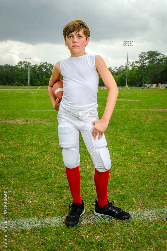 Youth Preteen Boy Football Player Standing on Field with Football in ...