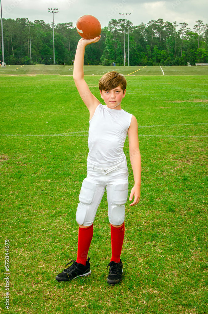 Youth Preteen Boy Football Player Standing on Field with Football in ...