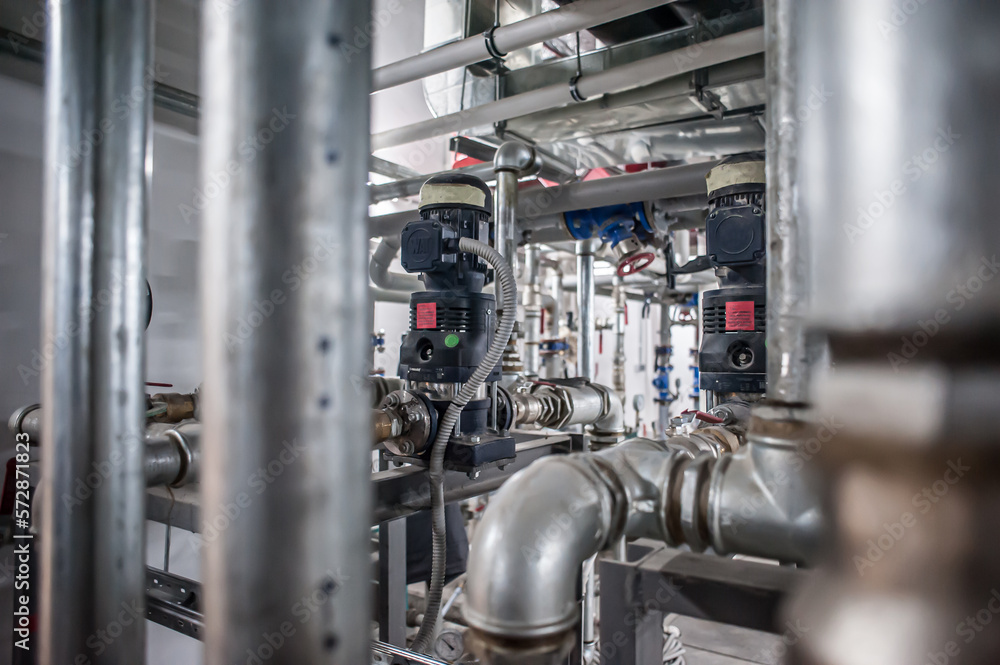 Huge industrial water pump and air handling unit in the ventilation ...