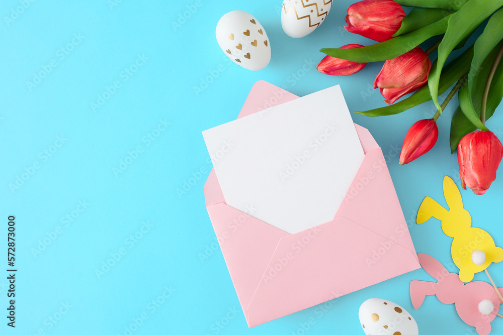 Easter concept. Flat lay photo of envelope with letter and white gold ...