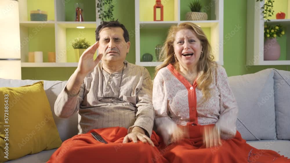 Couple watching horror and thriller movies on TV alone at home. Scared ...