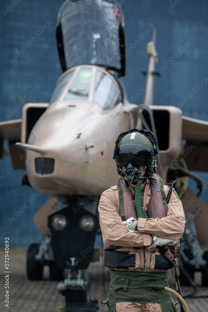 Military Fighter pilot standing with jet fighter ready for a combat ...