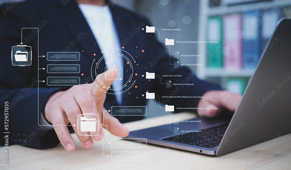 Businessman working of laptop with virtual document management concept ...
