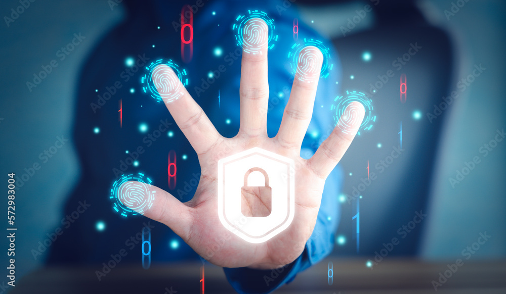 Biometric authentication and cybersecurity concept. Businessman unlocking his laptop computer ...