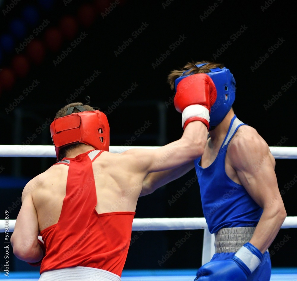 Two young men in the ring compete in boxing Stock Photo | Adobe Stock