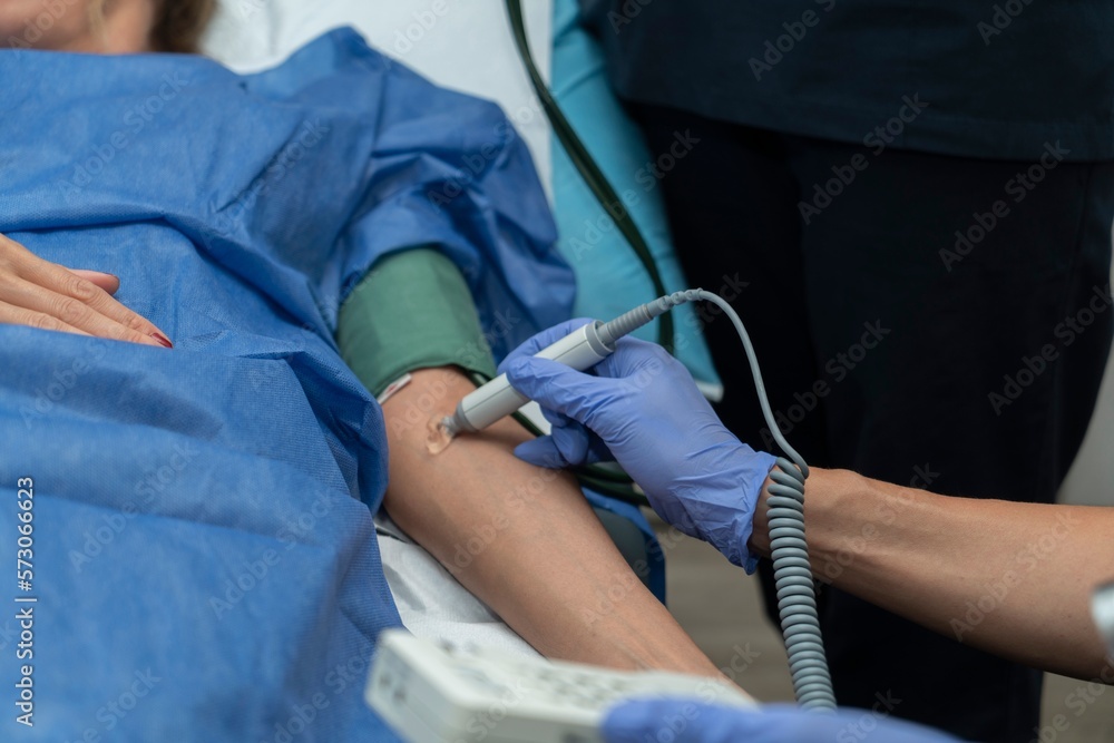 blood pressure measurement in the arm with the device, Ankle Brachial ...