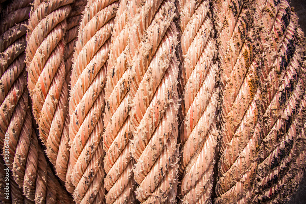 Thick rope, also known as a mooring line, that is used to tie a ...