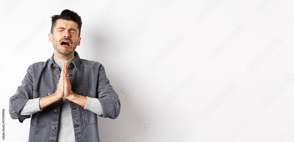 Miserable man begging for help, need something and crying, pleading ...