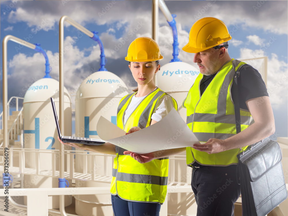 Hydrogen energy. Man and woman at construction power plant. Getting ...
