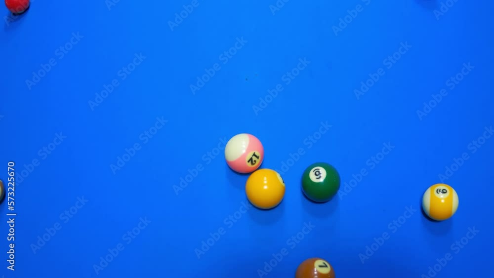 Top view of the beginning of the billiard game breaking balls. The ...