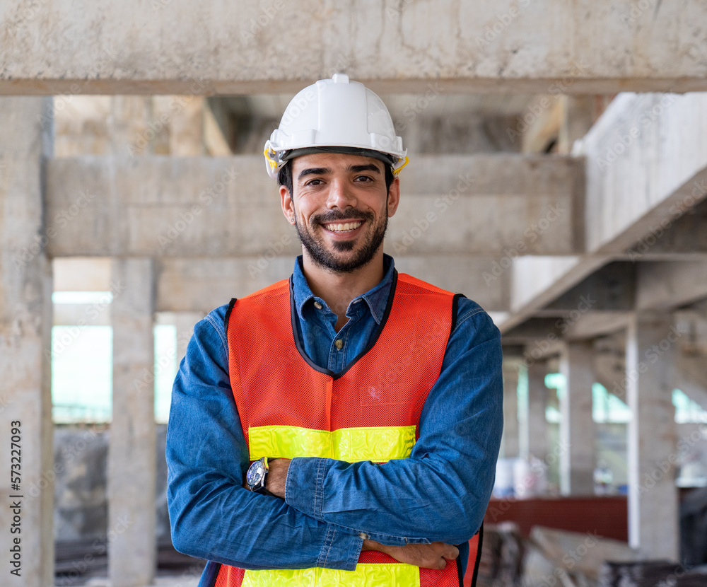 portrait of engineer or worker in safety equipment vest and helmet ...