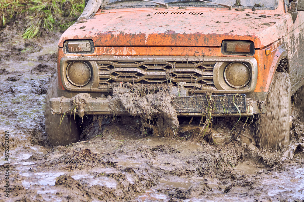 Old orange offroader sank into the mud while driving off-road, got ...