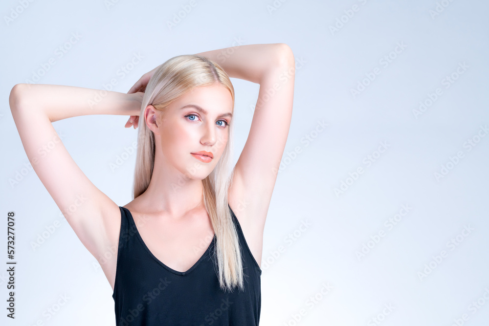 Personable woman lifting her armpit showing hairless hygiene underarm ...