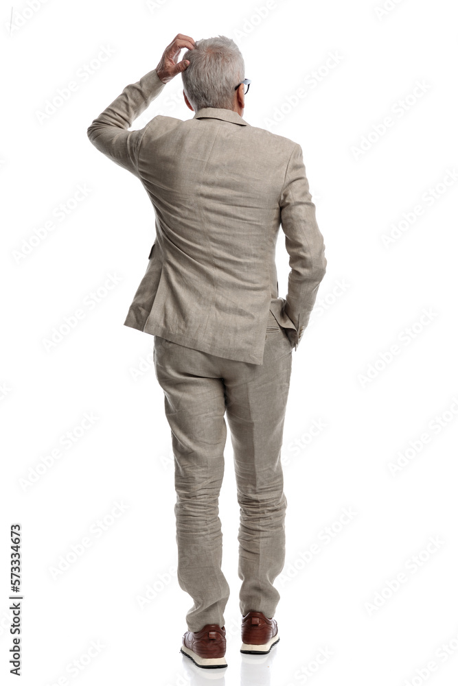 confused man with grey hair scratching head and thinking of ways to ...