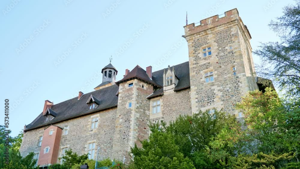 View from below of stone wall of medieval castle of Dukes of Bourbon on ...