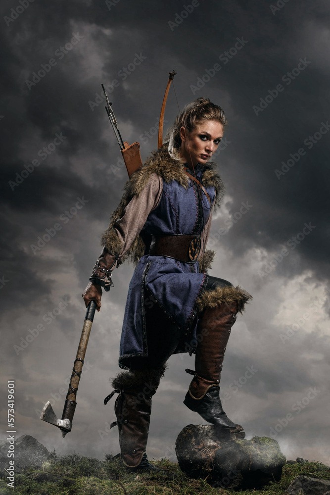 Beautiful female viking woman warrior in battle with ax and bow with ...