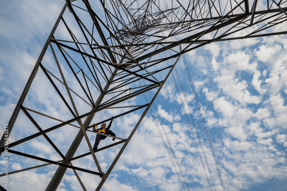 Asian electrical engineer wearing safety gear working high voltage ...