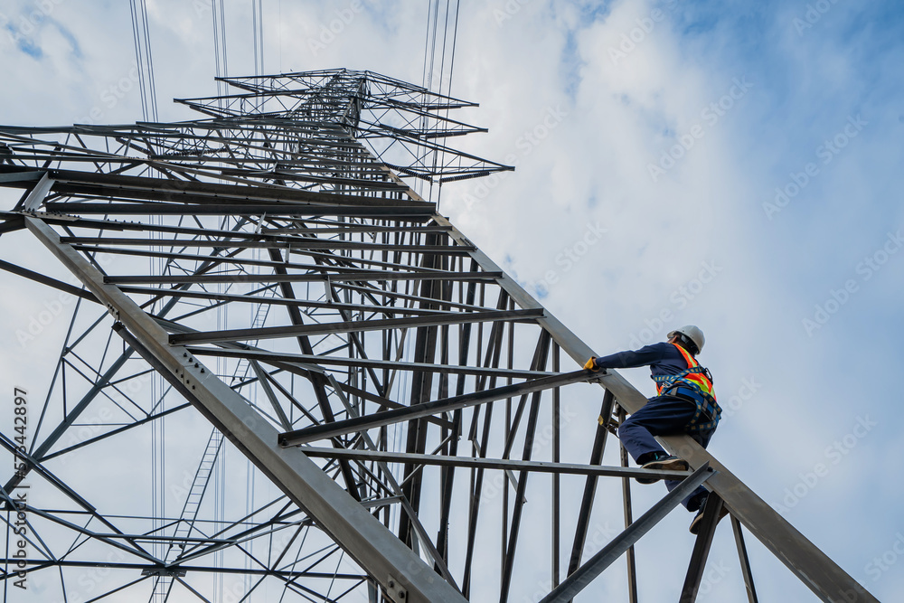 Asian electrical engineer wearing safety gear working high voltage ...