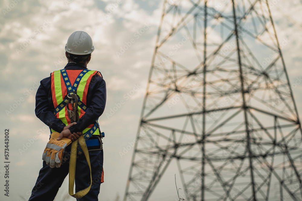Foto de Asian electrical engineer wearing safety gear working high ...
