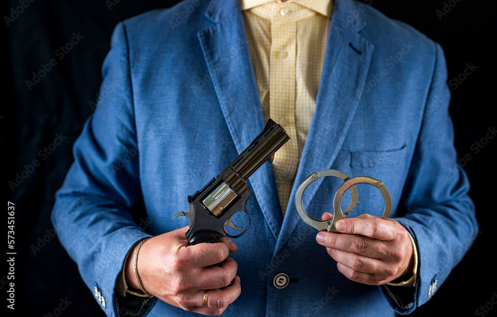 Sniper man in black suit gesturing and boldly holding gun on isolated ...