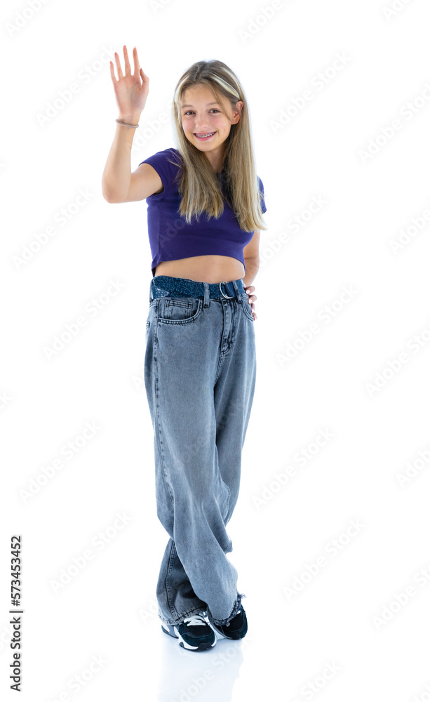 Full length portrait of sociable cheerful friendly teenager waving ...