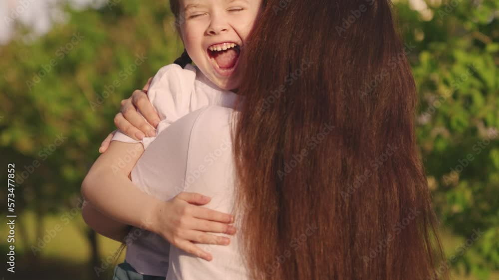 child runs hug his mother. happy family concept. cheerful child hugs ...