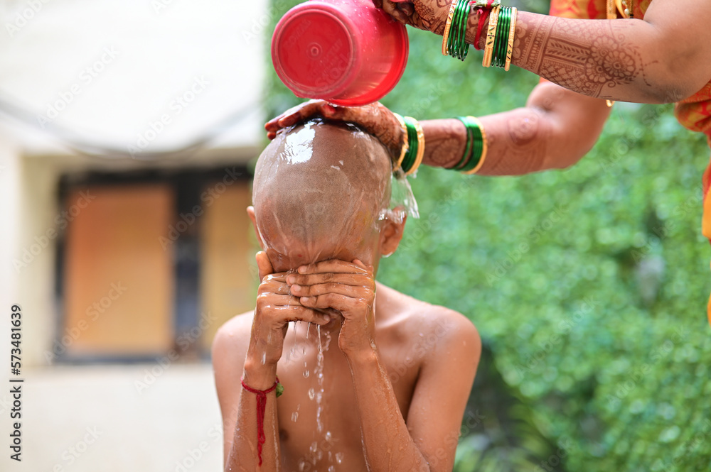 Hindu prayer Boy Bathing for hindu worship ceremony. Holy water. Indian ...