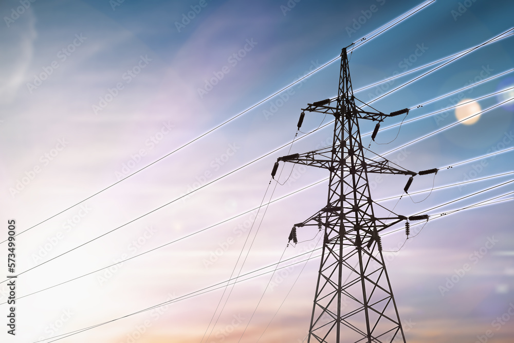 Poster high-voltage power pylon with luminous wires at sunset ...