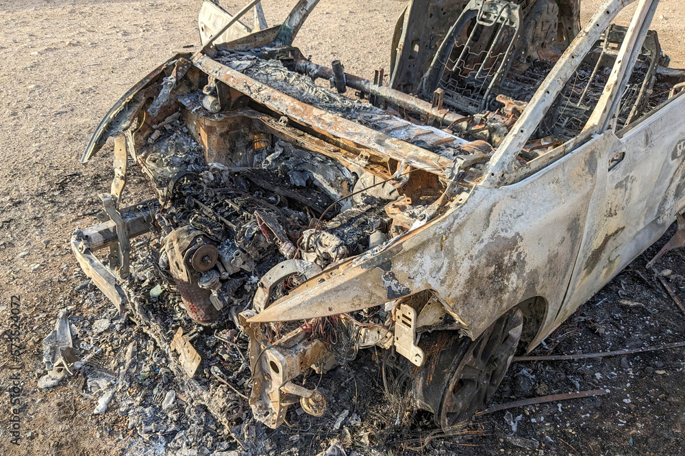 Car after the fire. Iron parts of burnt out car. Completely burnt ...
