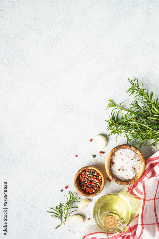 Ingredients for cooking on white kitchen table. Herbs, spices and ...