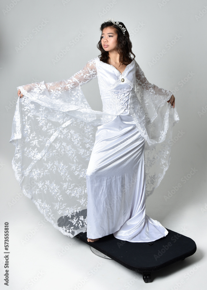 Full length portrait of beautiful woman wearing fantasy costume, white ...