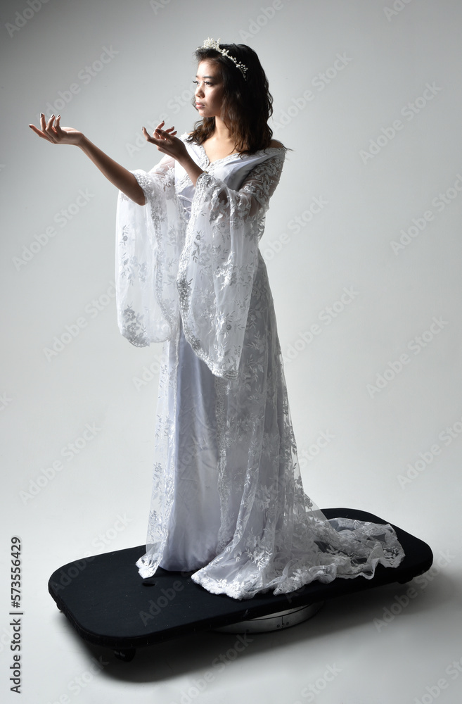 Full length portrait of beautiful woman wearing fantasy costume, white ...