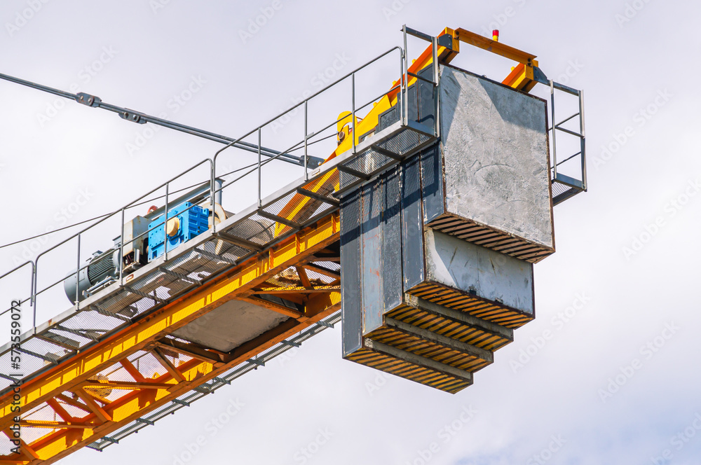 Boom tower crane with engine and counterweight. A tower construction ...