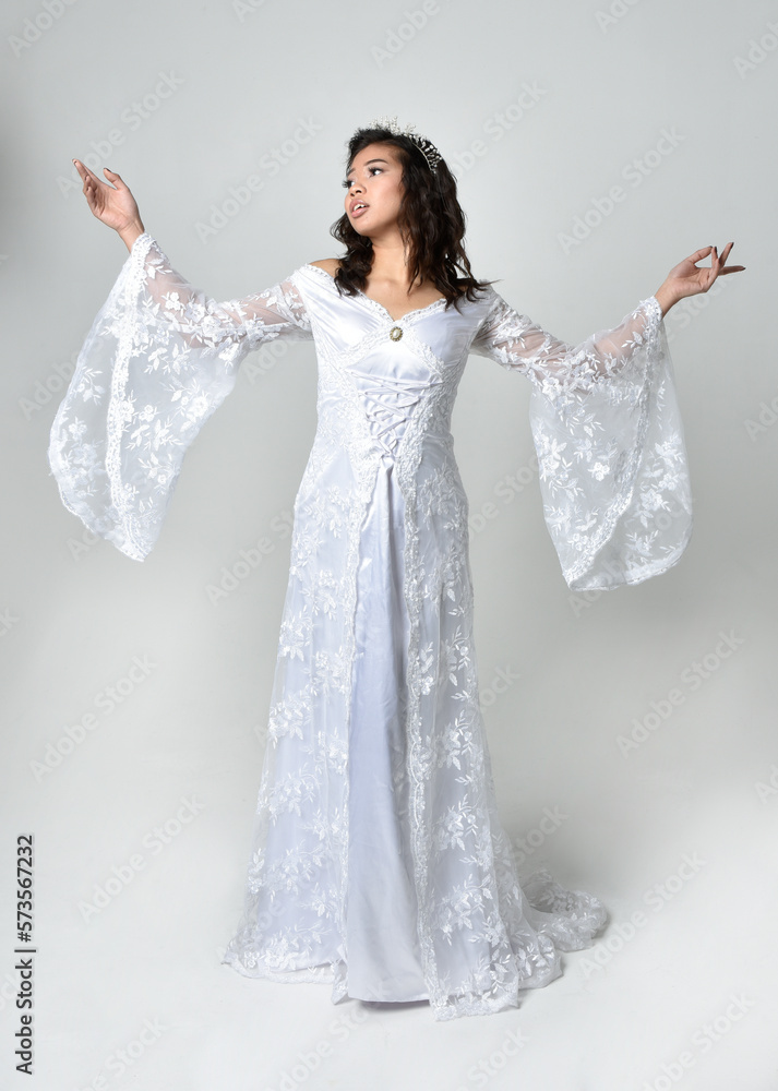 Full length portrait of beautiful woman wearing fantasy costume, white ...