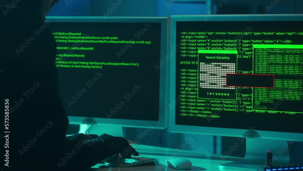 Hacker is typing on a computer keyboard and cracking a password. A man ...