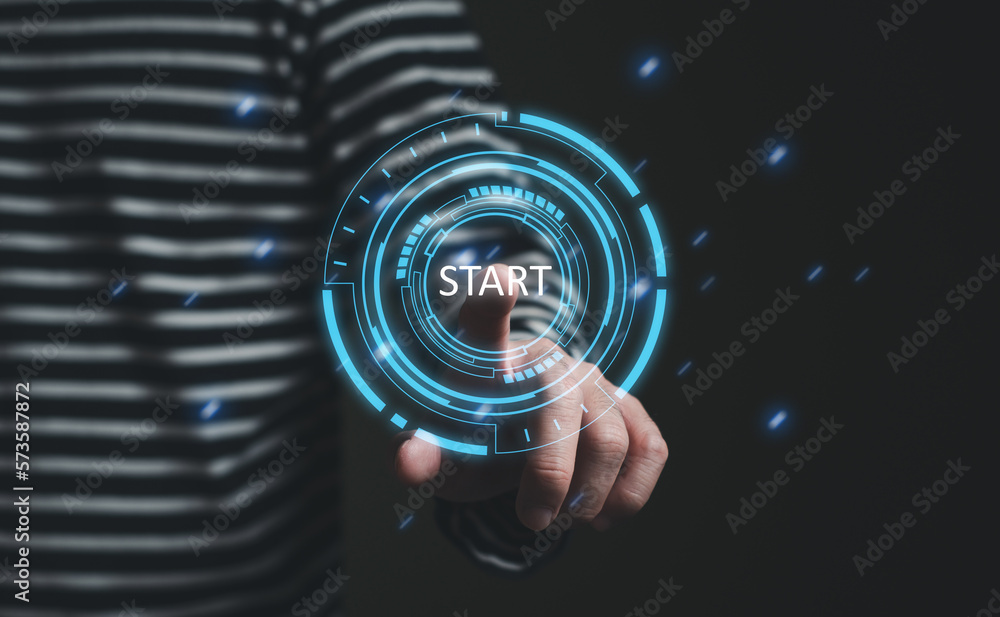 Close up shot of people hand press digital start button in front of ...