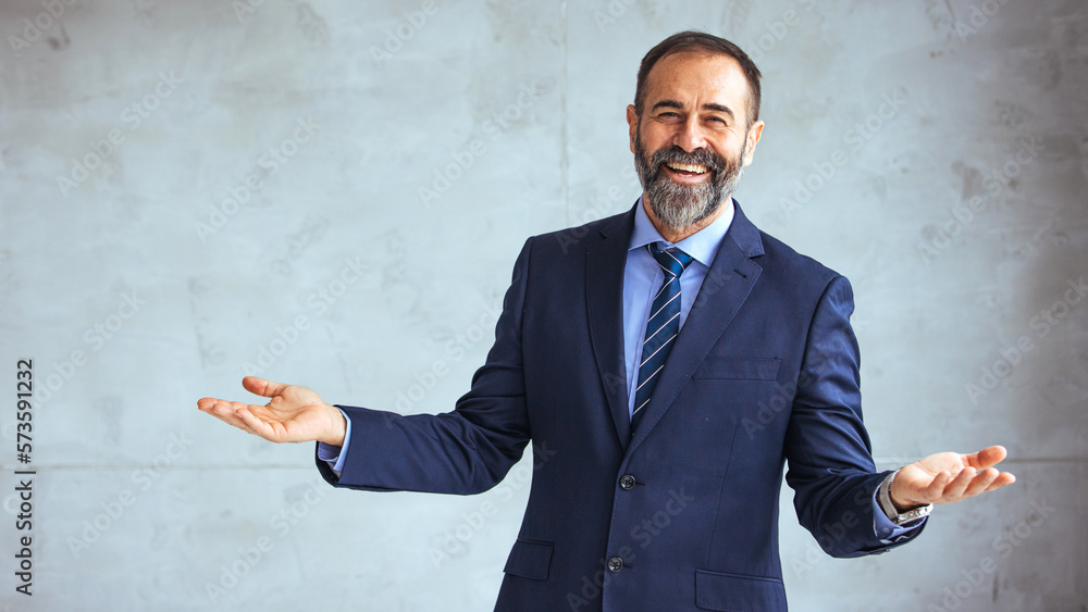 Mature cheerful executive businessman at workspace office. Portrait of ...